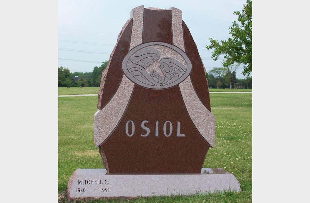 Red granite monument with contemporary holy family carving – Krause ...